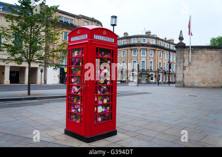 Traditional red telephone box filled with flowers Stock Photo - Alamy