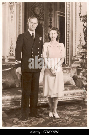 Princess Elizabeth and fiance Lieutenant Philip Mountbatten announce their engagement arm in arm ...