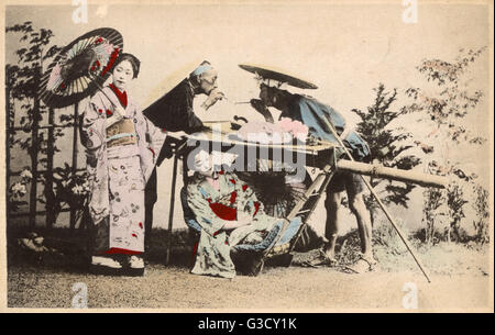 Geisha girl smoking a cigarette in the Japanese city of Kyoto, Japan ...