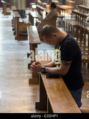 Man praying / Genuflecting, in Roman Catholic Church, London Stock ...