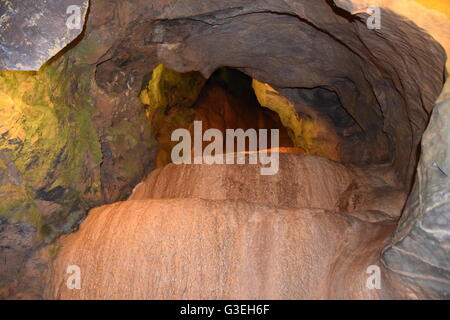 Stalactites formed down the wall by water in the limestone caves of ...
