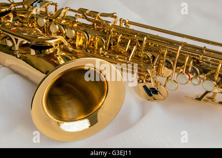 saxophone on delicate White silk Stock Photo - Alamy