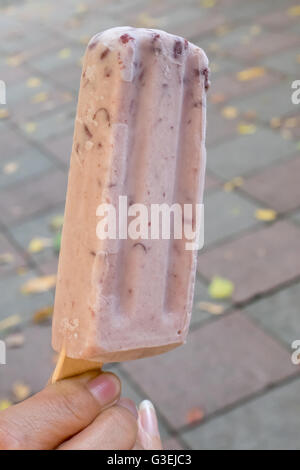 Sweet red bean popsicle closeup. Ice pops are a delicious way to cool ...