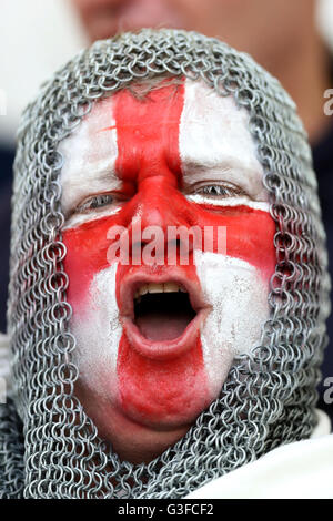 An England fan wearing face paint shows support for his team ahead of ...
