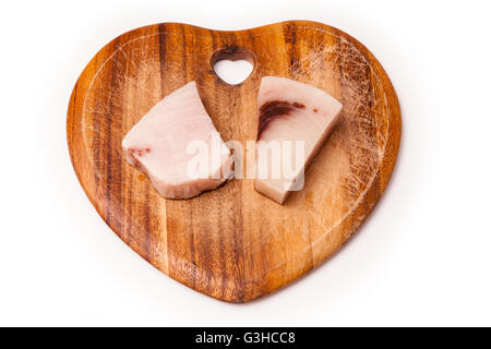 Swordfish ( Xiphais gladius) steak portions uncooked and isolated on a ...