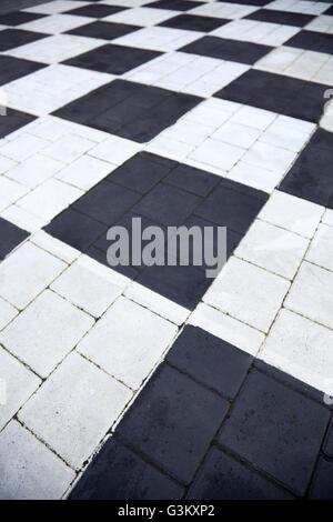 The ground is marked with a black and white checkered pattern ...