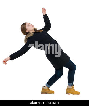 Balancing young woman. or dodge falling woman. Rear view people ...