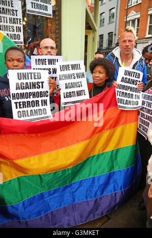 LGBT flag in Soho,London. People walking in Soho London,Brewer street ...