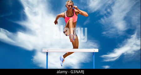 Composite image of athletic woman practicing show jumping Stock Photo ...