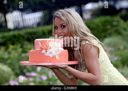 Coral brand ambassador Carly Baker models a hat made out of cake ...