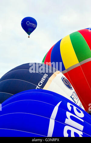 Inflating balloons at the Bristol Balloon Festival where the weather ...