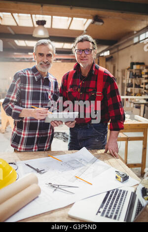 Carpenters using a tablet computer Stock Photo - Alamy