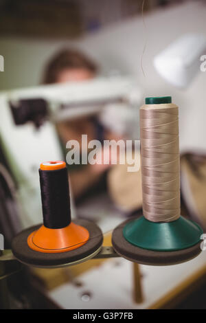 Manual sewing machine with thread spools, zipper, buttons and cloth ...