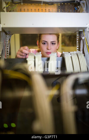 Technician working on broken server Stock Photo - Alamy
