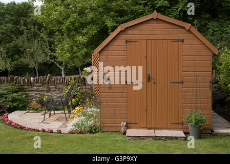 Brown chairs in small country living room Stock Photo - Alamy