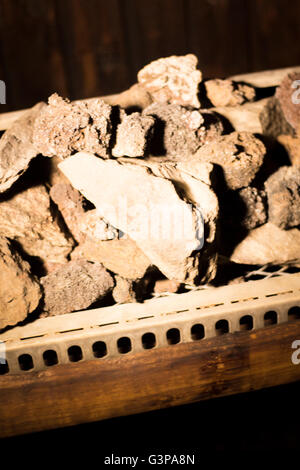 Wood sauna heated rocks heater photo Stock Photo - Alamy