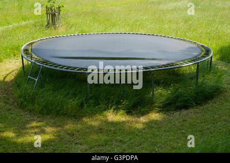 Torn trampoline mat. Polypropylene bed for a trampoline that has Stock ...