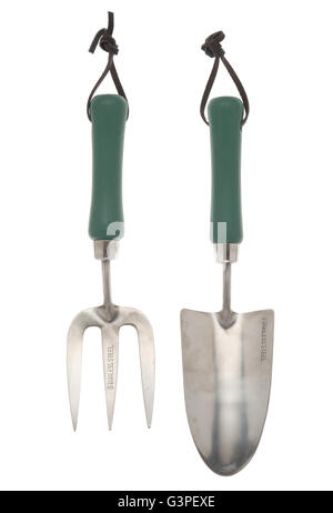 set of gardening tools on wooden table in garden Stock Photo - Alamy