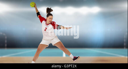 Composite image of sportswoman throwing a ball Stock Photo - Alamy