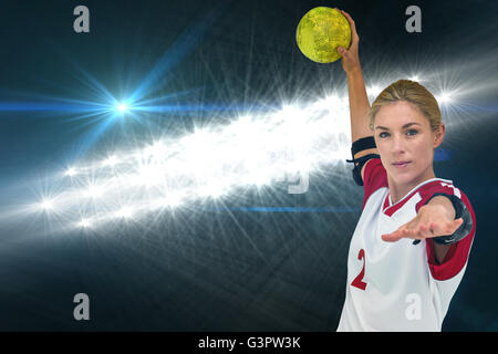 Composite image of sportswoman throwing a ball Stock Photo - Alamy