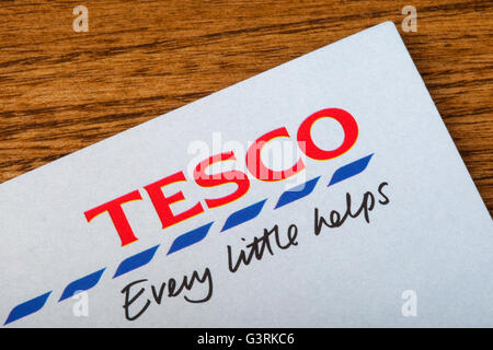 Close-up of Tesco Every little Helps slogan printed on back of a till ...