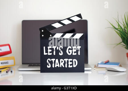 Cinema Clapper with Get Started word Stock Photo - Alamy