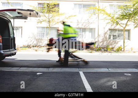 Ambulancemen carrying injured man on a stretcher Stock Photo - Alamy