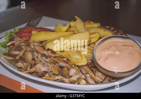 Gyros on the plate with vegetables Stock Photo - Alamy