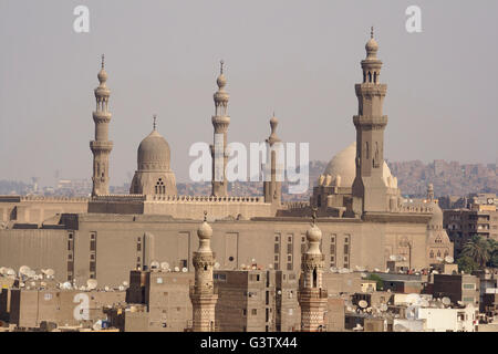 The Minarets and domes of Sultan Hassan Mosque and Al Rifai Mosque, Cairo, Egypt on a cloudy sky ...