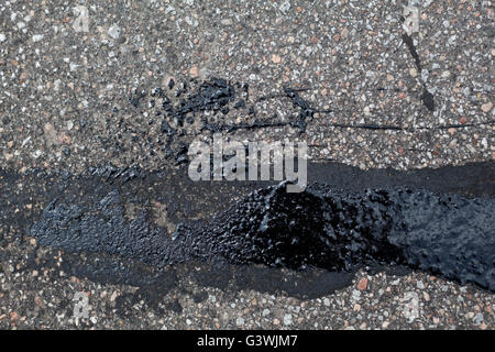 Strip of fresh tar on a weathered asphalt surface Stock Photo - Alamy
