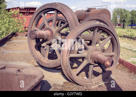Steel wheelset of railway cars on rails Stock Photo - Alamy