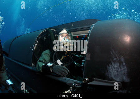 U.S. Navy SEAL combat diver prepares for HALO jump operations from a ...