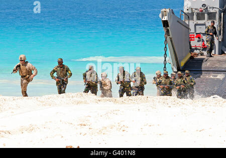 U.S. Marines assault beachhead from amphibious landing craft on Barrier ...