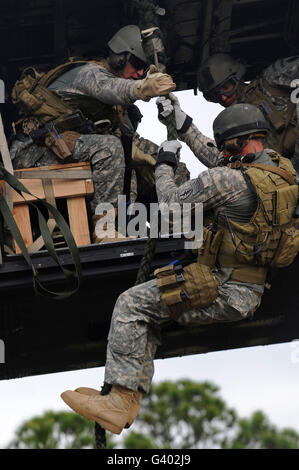 Special operations forces fast-rope from an MH-47 Special Operation ...