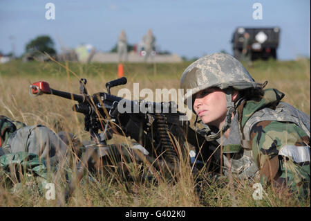 A Squad Automatic Weapon machine gunner on patrol Stock Photo - Alamy