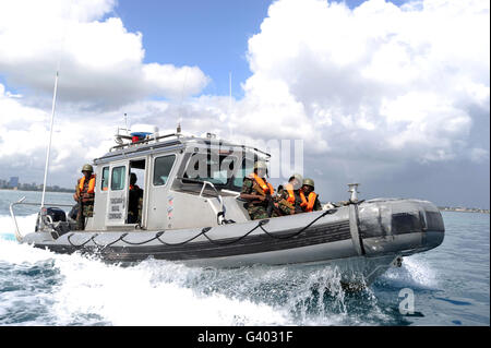 Tanzania People's Defense Force and U.S. Navy sailors pilot boats to ...