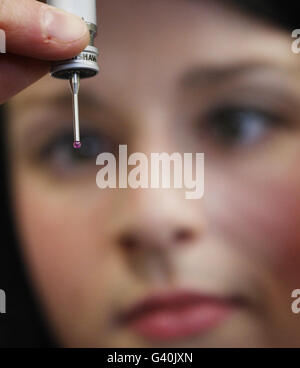 Laboratory technician Lisa Muir holds a Coordinate Measuring Machine at ...