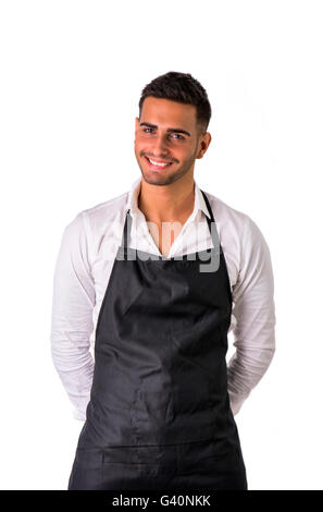 Smiling male waiter welcoming guests to country restaurant Stock Photo ...