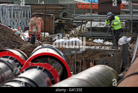 A photographer takes pictures of the scene at offshore Engineering firm ...