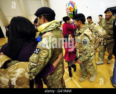 Servicemen of 2 Signal Regiment return to their base at Imphal Barracks ...