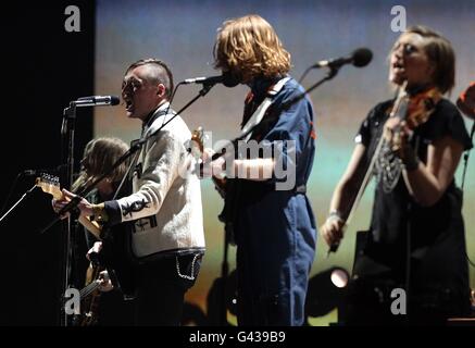 Arcade Fire perform on stage during the 2011 Brit Awards at the O2 ...