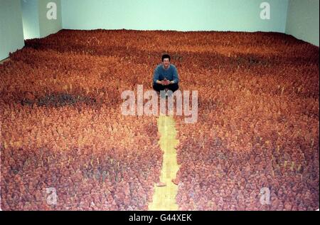 Artist Antony Gormley overseeing the installation of his "Field for the ...