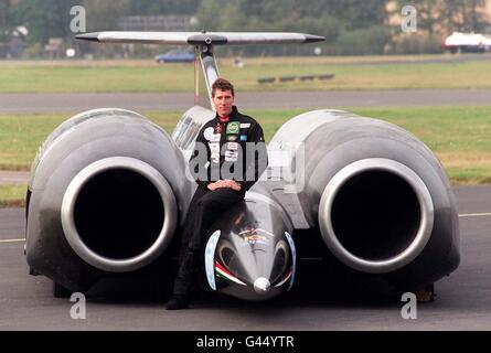 Squadron Leader Andy Green perches on the body of the Thrust SSC car ...