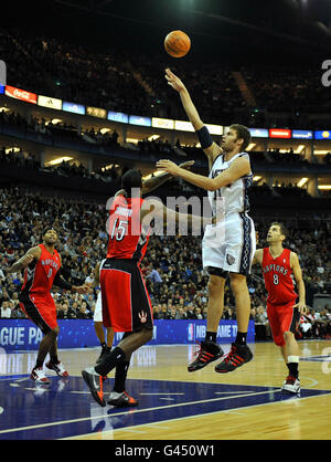 Toronto Raptors' Amir Johnson (centre) battles for the ball with ...