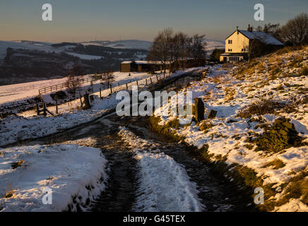 Farm and winter snow, Greenfield, Saddleworth, UK, near sunset Stock ...