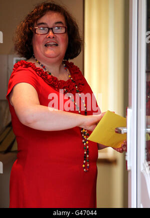 Singer Susan Boyle opens a birthday card as she celebrates turning 50 ...