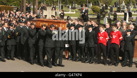 The coffin of PSNI Constable Ronan Kerr is carried through his home ...
