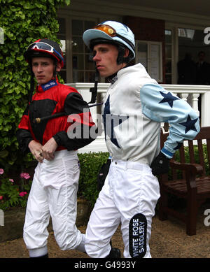 Jockeys make their way to the parade ring before the Coral Finale ...