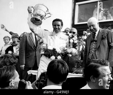 Jim Clark (GB) with the Mervyn O'Gorman Trophy after winning the ...