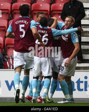 West Ham United's Demba Ba (left) heads home the opening goal of the ...